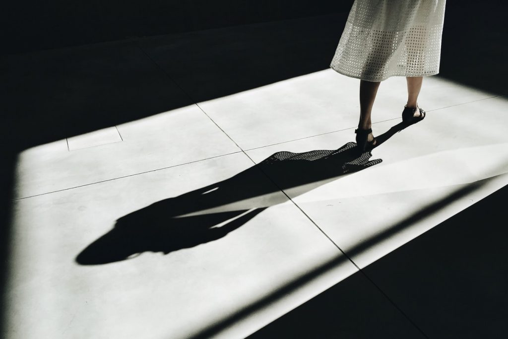 Photo of the shadow a woman leaves behind while walking | Envision your ...